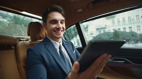 Premium Photo Happy Male Professional Reading Messages On Tablet