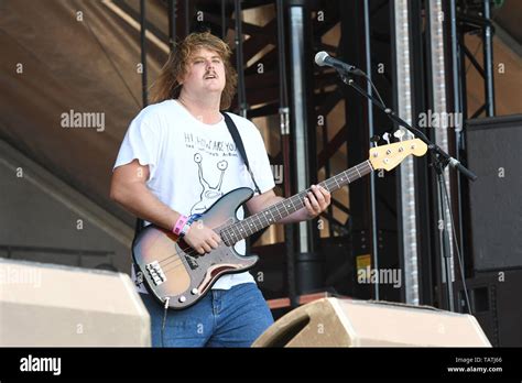 Singer And Bass Guitarist Toby Cregan Is Shown Performing On Stage During A Live Concert