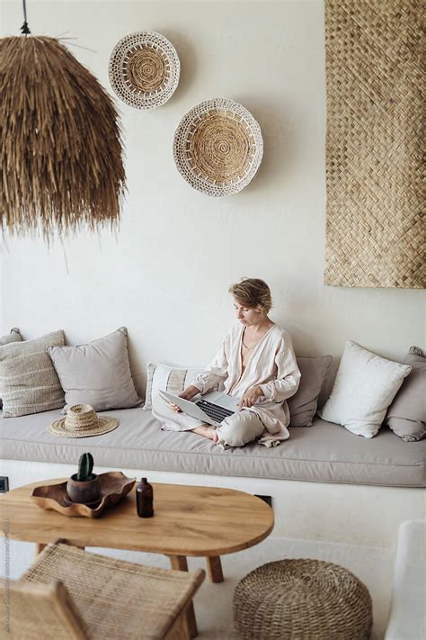 Woman Using Laptop At Home By Stocksy Contributor Alexander