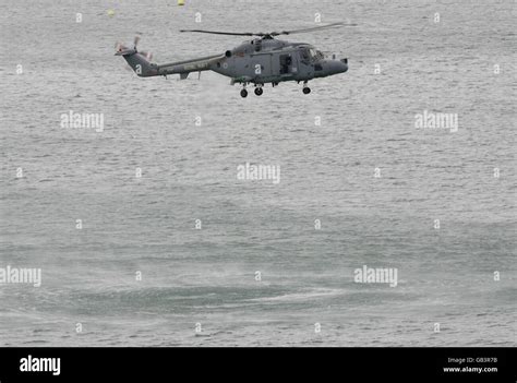 A Royal Navy Lynx Helicopter Flying At The Royal Navy Base In