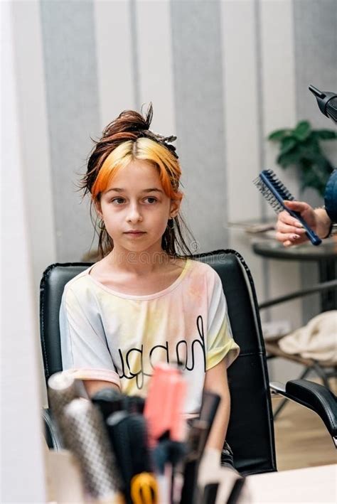 The Hairdresser Dyes The Hair Of The Girl In The Beauty Salon Fashion