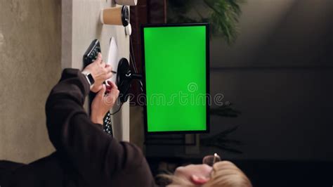 Woman Working In Office On Desktop Computer With Green Screen Mock Up Display Vertical Video