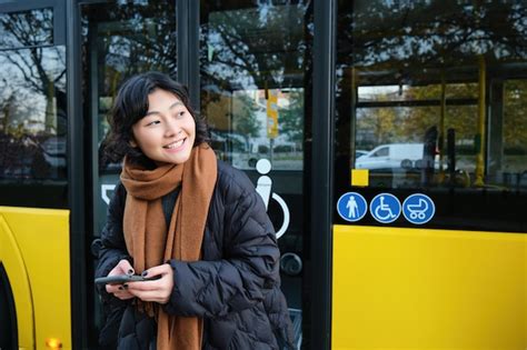 Premium Photo Portrait Of Korean Girl Looking For Her Bus On A Stop