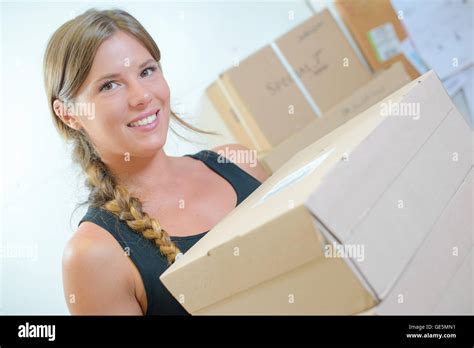 Woman Carrying Boxes Stock Photo Alamy