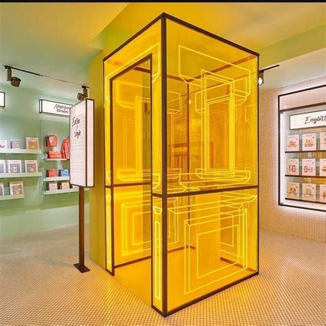 A Yellow Display Case In The Middle Of A Room