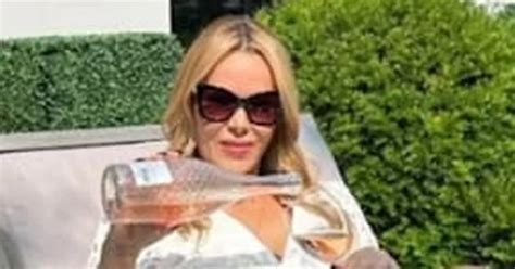Amanda Holden Dazzles Fans In Tiny Shorts As She Tops Up Her Golden Tan