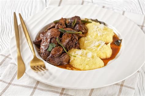 Premium Photo Chicken Livers With Sage Served With Polenta On A White
