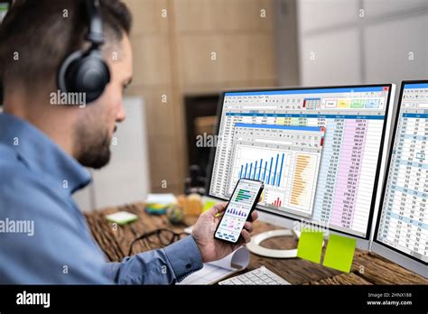 Computer Spreadsheet Data Analyst Man Using Multiple Screens Stock