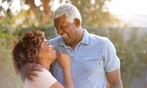 Portrait Of Smiling Senior African American Couple In Garden At Home