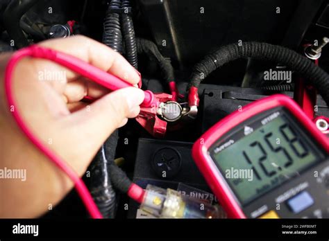 Car Battery Voltage Testing With A Digital Multimeter By Auto