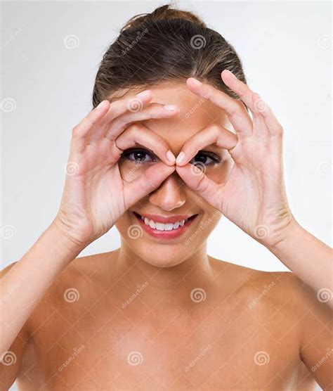 Peek A Boo Portrait Of A Beautiful Young Woman Posing Playfully In The