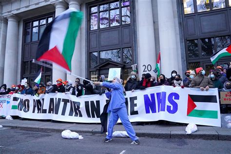 protesters blockade office of tech giant with nhs contract over ties to