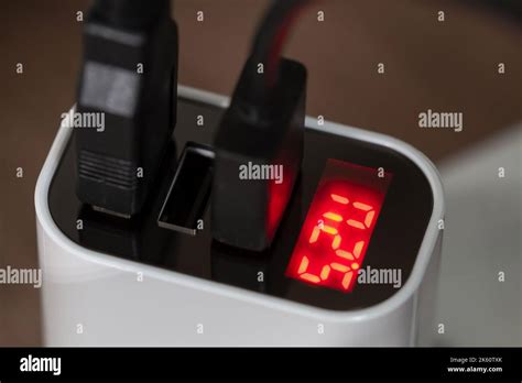 Mobile Devices Are Charging From Socket Charger For Three Usb Ports