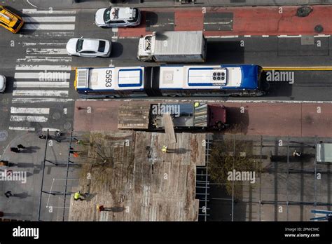 Workers Dismantling Sidewalk Protective Scaffolding Shot From Above