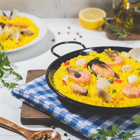 Seafood Paella On Traditional Pan Paella On White Wood Base Square