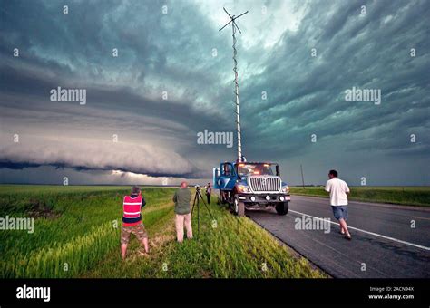 Storm Chasing Tornado Researchers Outside A Doppler On Wheels Dow