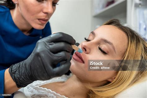 Master Applying Cosmetics Gel Wax Upper Lip Before Hair Removal