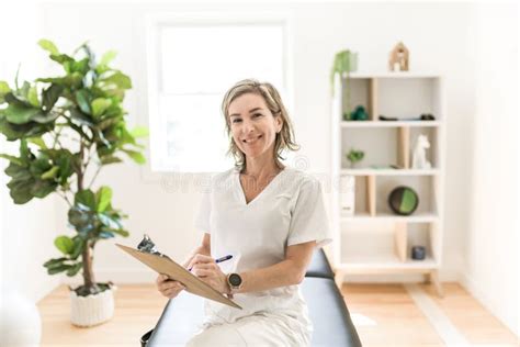 Portrait Of A Physiotherapy Woman Smiling In Uniforme Stock Image