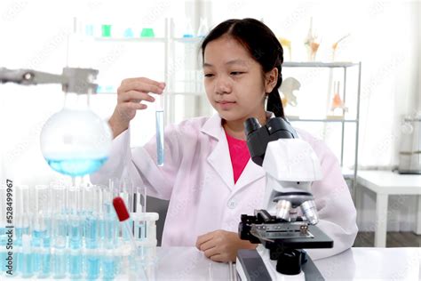 Adorable Schoolgirl In Lab Coat Doing Science Experiments Young