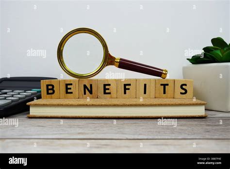 Magnifying Glass With Wooden Blocks Alphabet Letters Benefits Text Message On Wooden Background