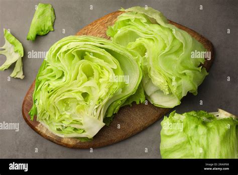 Flat Lay Composition With Fresh Green Cut And Whole Iceberg Lettuce