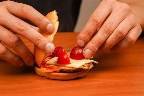 Cooking Hamburger Close Up Shot Of Young Man Eats Burger Home Delivery Man Holds Burger With