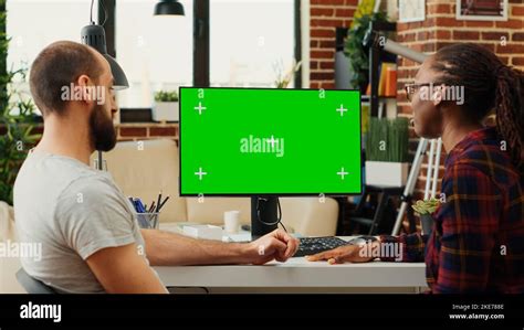 Diverse People Working With Greenscreen Monitor On Computer Analyzing Isolated Chroma Key On