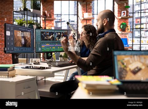 Video Editors Couple Working As A Team For A Freelance Video Shoot Editing And Mixing Video