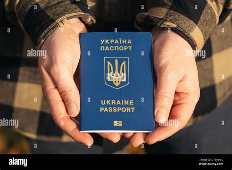 New Ukrainian Blue Biometric Passport With Identification Chip In Hands