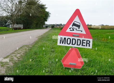 Warning Sign For Mud Or Modder In Dutch On The Road In An Agricultural