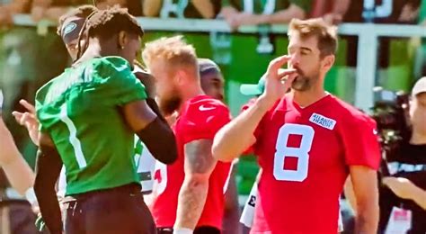 Aaron Rodgers And Sauce Gardner Share Smoking Up Handshake