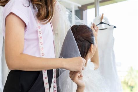 Premium Photo Portrait Of Asian Woman Choosing Dress In A Shop With