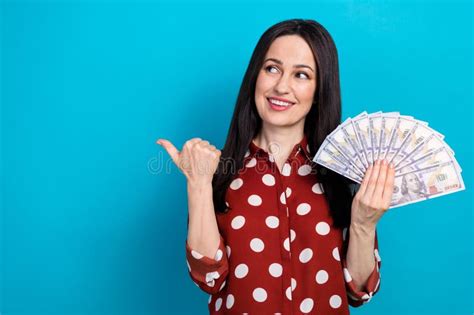 Photo Portrait Of Pretty Female Hold Money Fan Point Look Empty Space