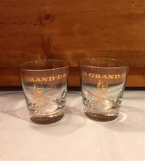 Two Glasses Sitting On Top Of A Table