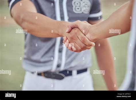 Closeup Of Two Sportsmen Shaking Hands Before A Game Hands Pf Baseball Players Congratulating