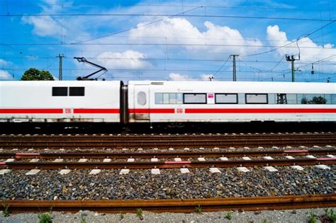 Premium Photo Passenger Trains On Tracks Against Sky