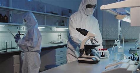 Epidemiologist Using Microscope In Lab Science Stock Footage Ft