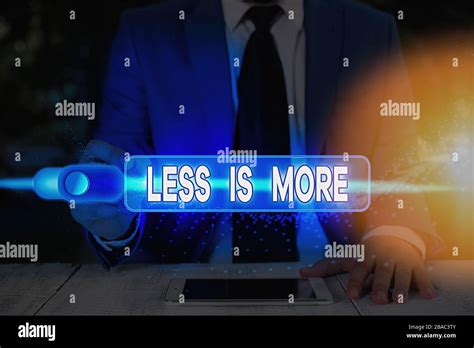 Handwriting Text Less Is More Conceptual Photo Used To Express A