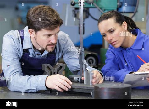 Female Cnc Machine Operator And Industrial Engineer Stock Photo Alamy