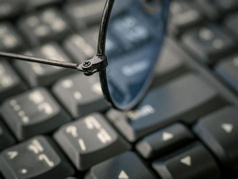 Premium Photo Cropped Hand Of Glasses Using Laptop