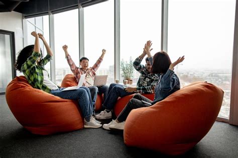Managers Celebrating Success By Giving High Five In Office Stock Image Image Of Excited