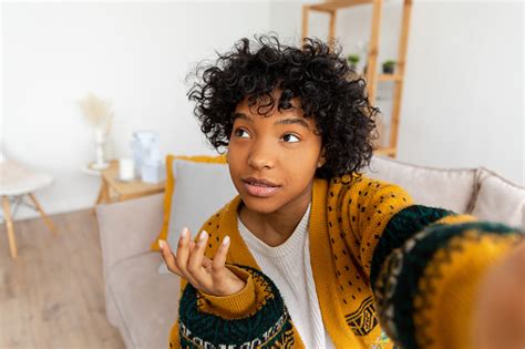 Happy African American Teen Girl Blogger Smiling Face Talking To Webcam