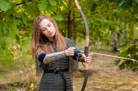 Medieval Warrior Woman In Chain Mail And Bracers With A Bow In Her