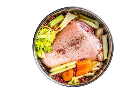 Cooking Of Eisbein From Raw Pork Hock Ham Shank With Vegetables And