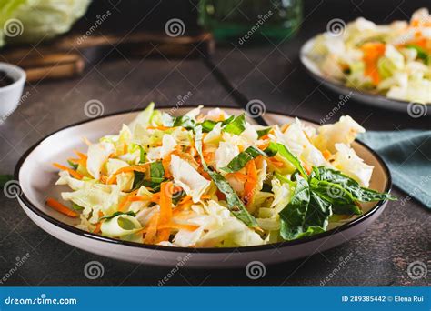 Traditional Cole Slaw Salad Of Cabbage Carrots And Greens On A Plate