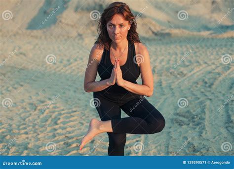Young Woman Doing One Legged Squat Yoga Pose Stock Image Image Of Pada Background 129390571