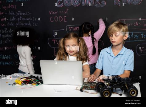 Smart Girl In White Bib Learning About Coding Robotics Technology Using