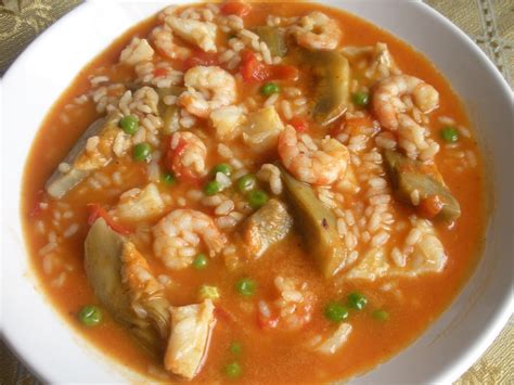 Aquí Se Cocina Arroz Caldoso De Alcachofas Bacalao Y Gambas