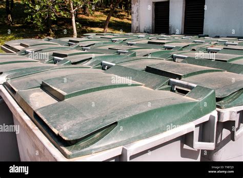 Large Garbage Containers Trash Dumpsters And Bins Standing In Row