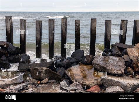 Concrete Pillars And Stones As A Parts Of A Broken Breakwater At Baltic